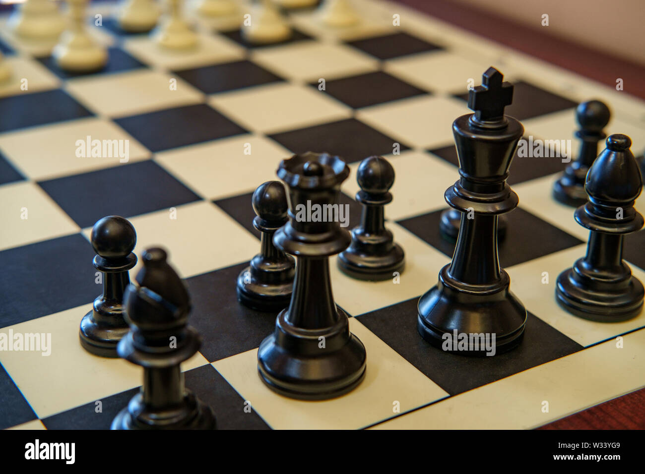 Chess pieces and board set up for beginning of game Stock Photo - Alamy