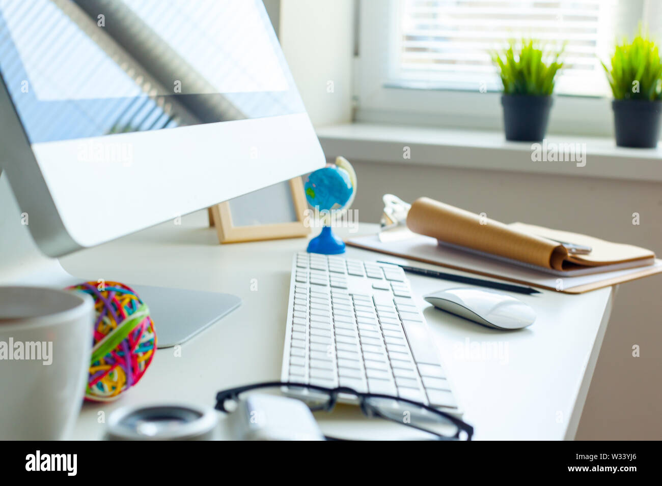 working table with computer Stock Photo - Alamy