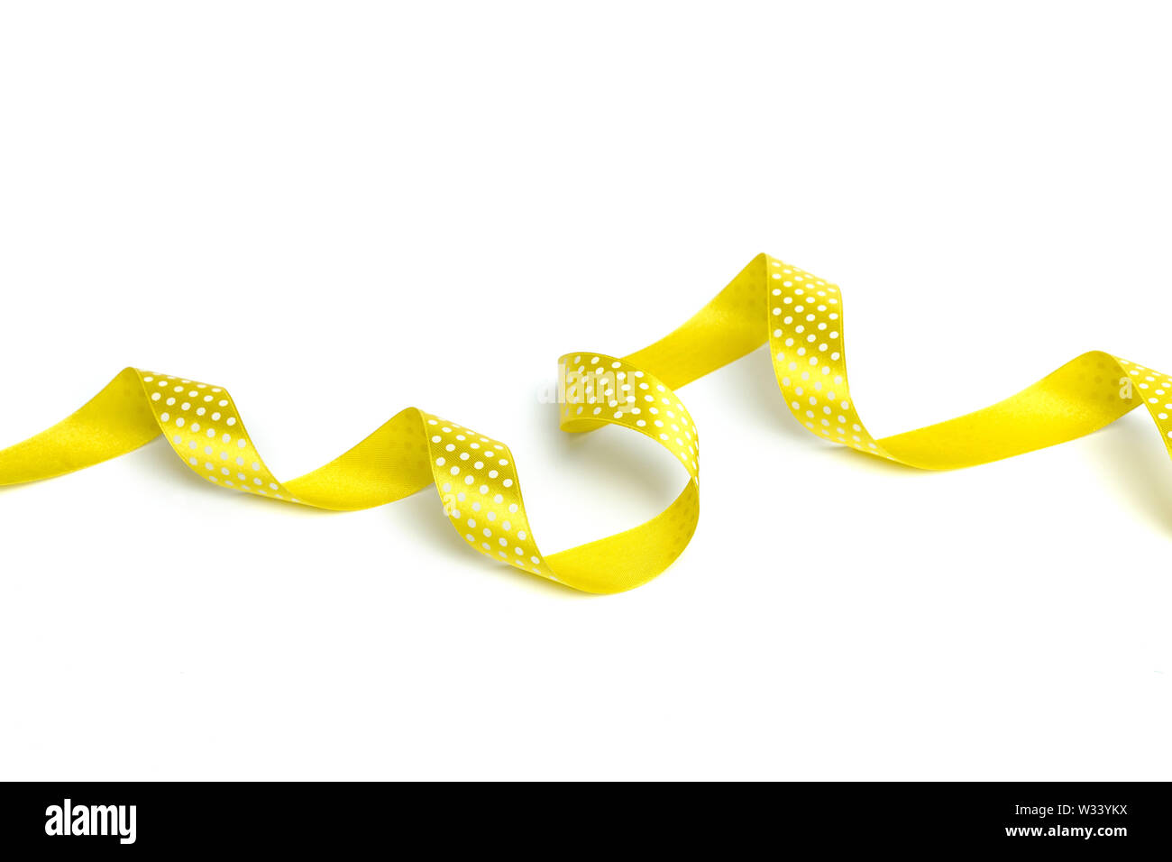 Yellow ribbons isolated on white Stock Photo - Alamy