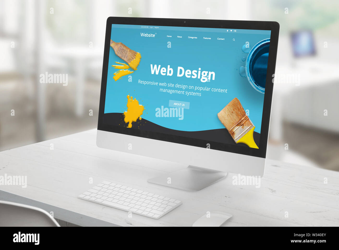 Web design studio concept with computer display on office desk and modern, flat web design ...
