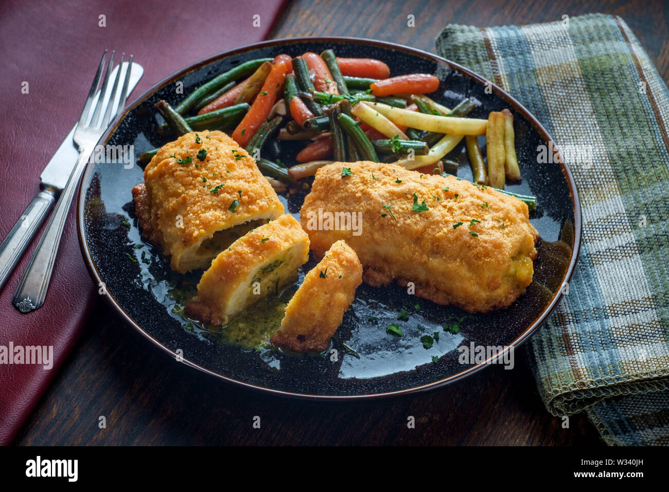 Russian cuisine stuffed chicken cutlets kiev-style with butter sauce ...