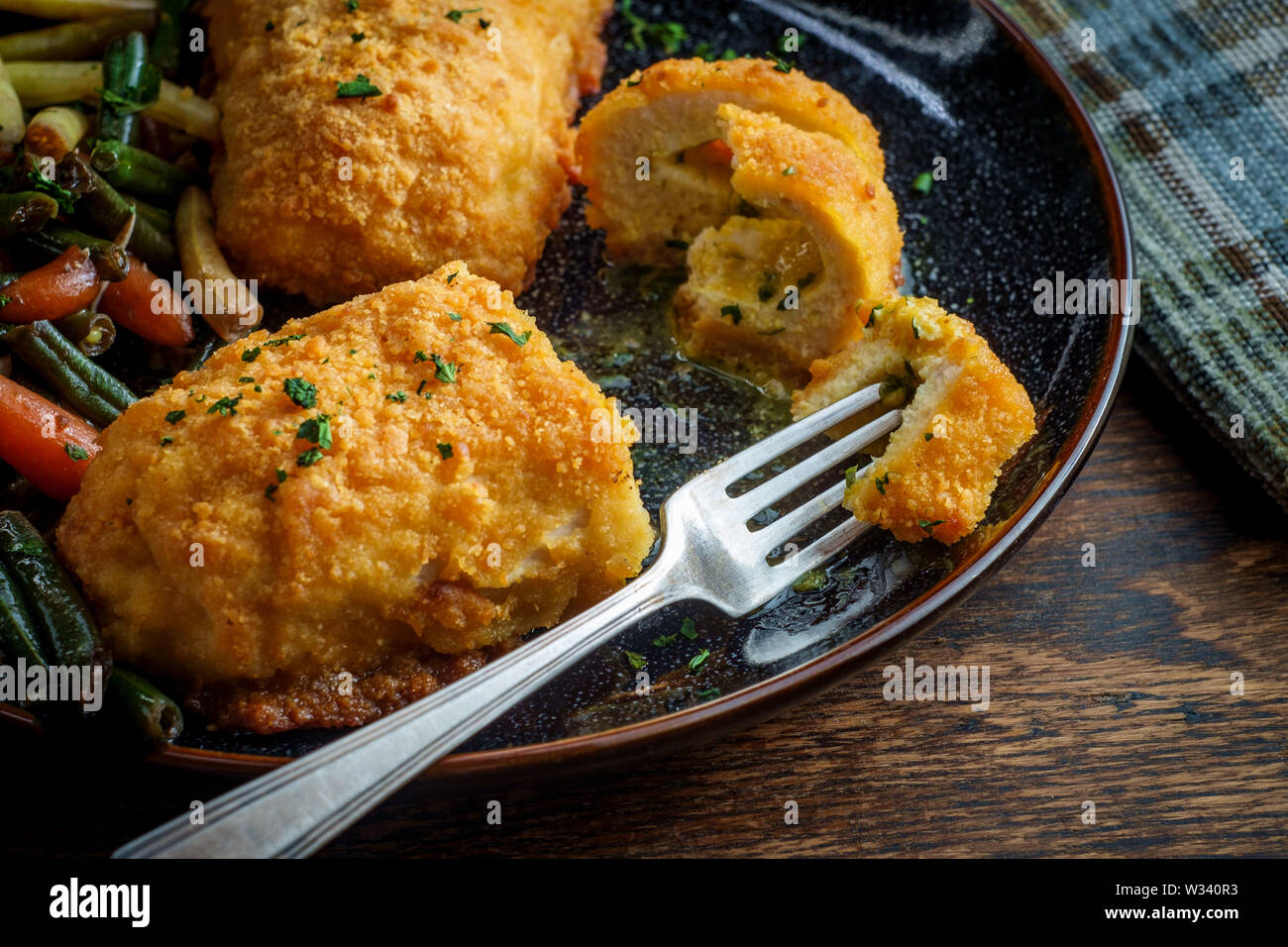 Russian cuisine stuffed chicken cutlets kiev-style with butter sauce ...