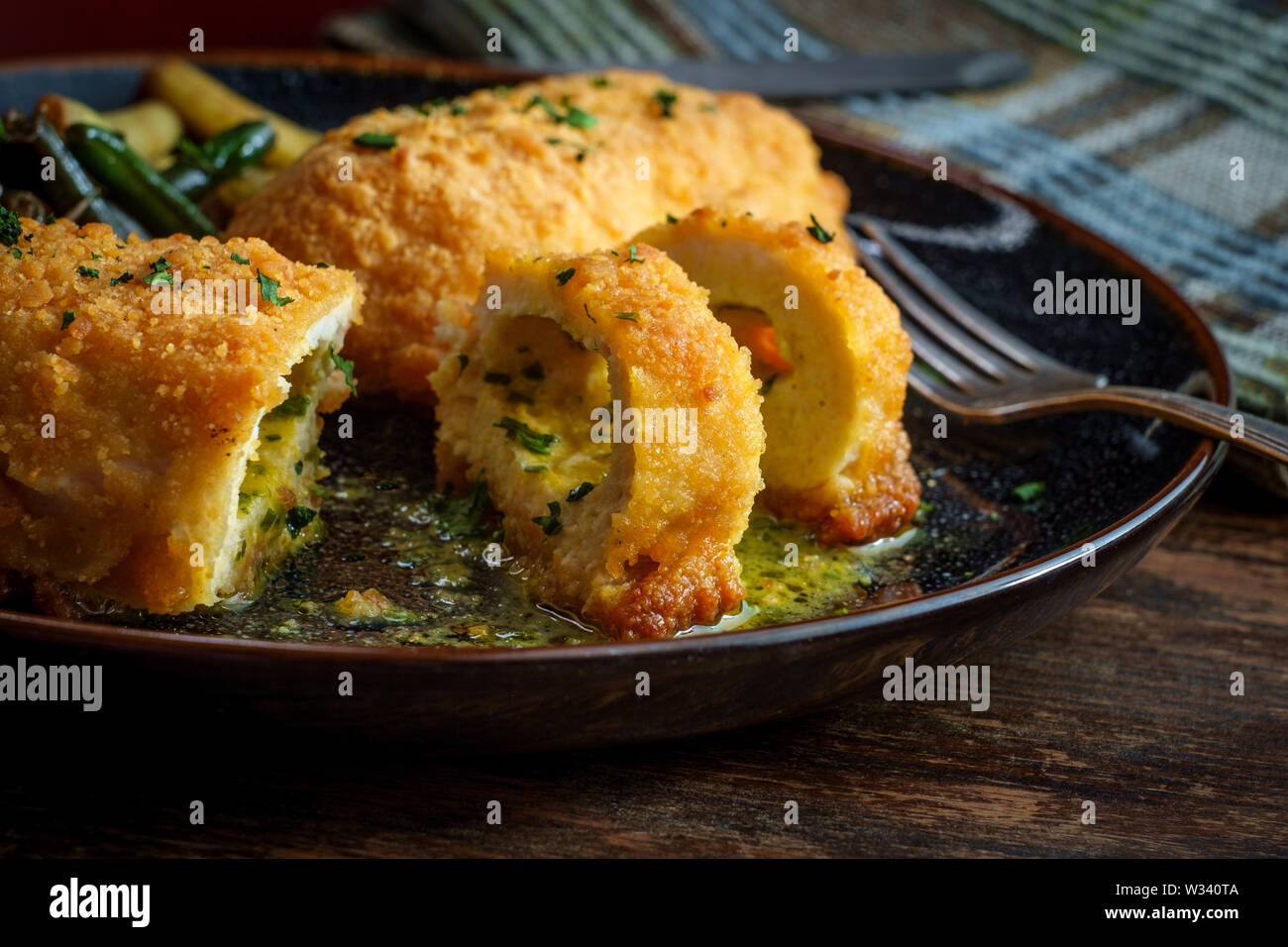 Russian cuisine stuffed chicken cutlets kiev-style with butter sauce ...