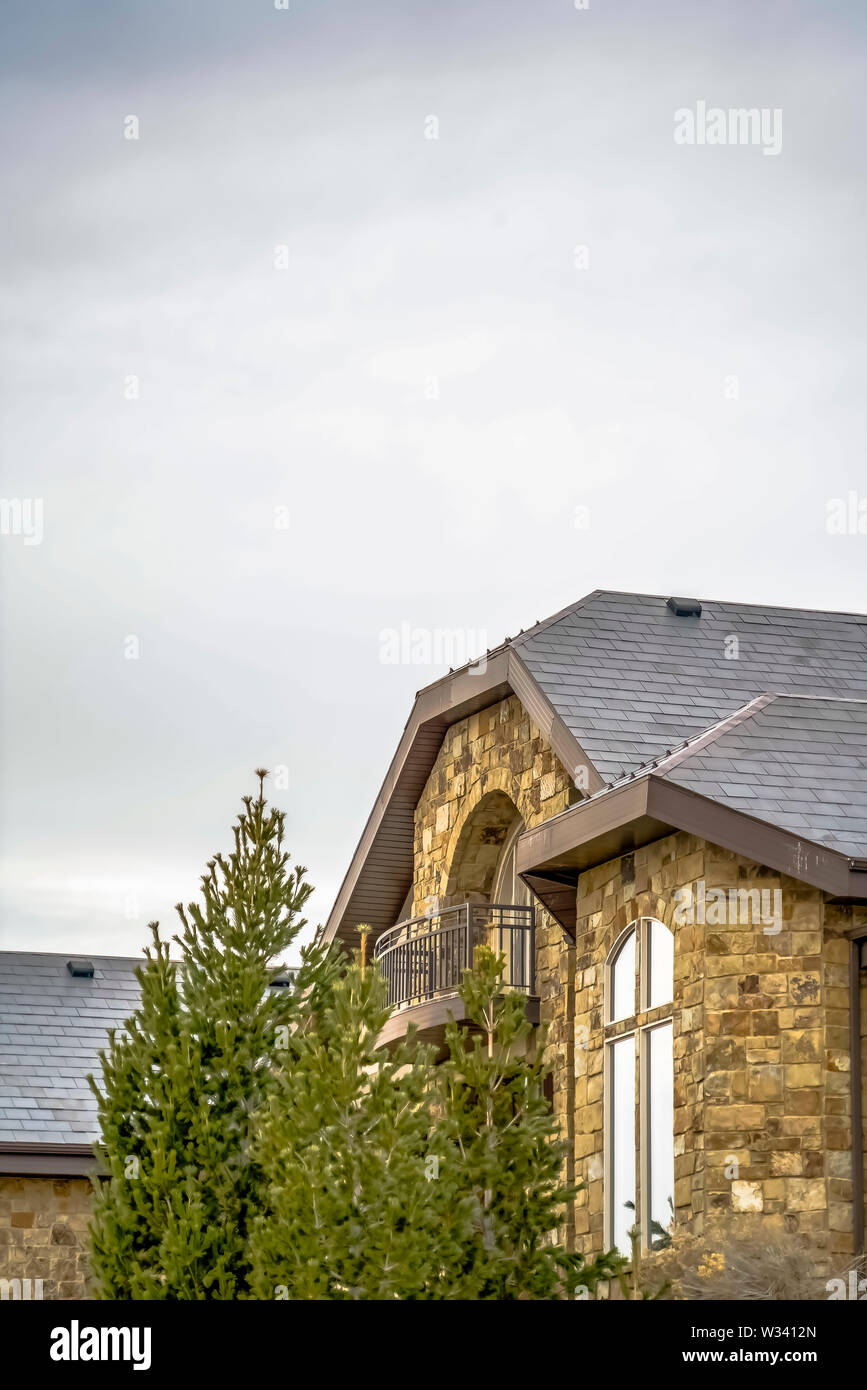 Stone home with half circle balcony and quarter round with extended leg ...