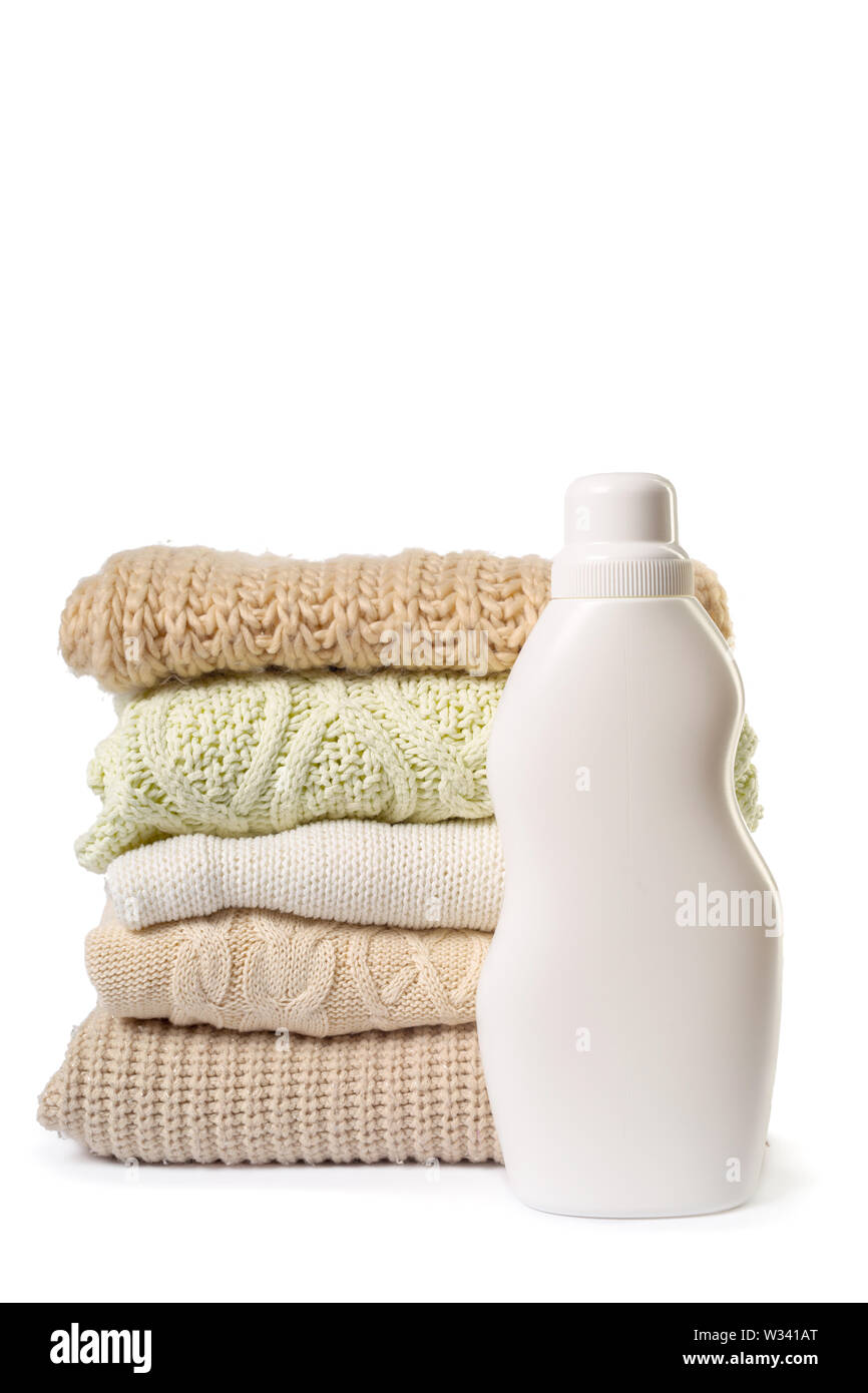 Stack of various sweaters isolated on white background Stock Photo - Alamy