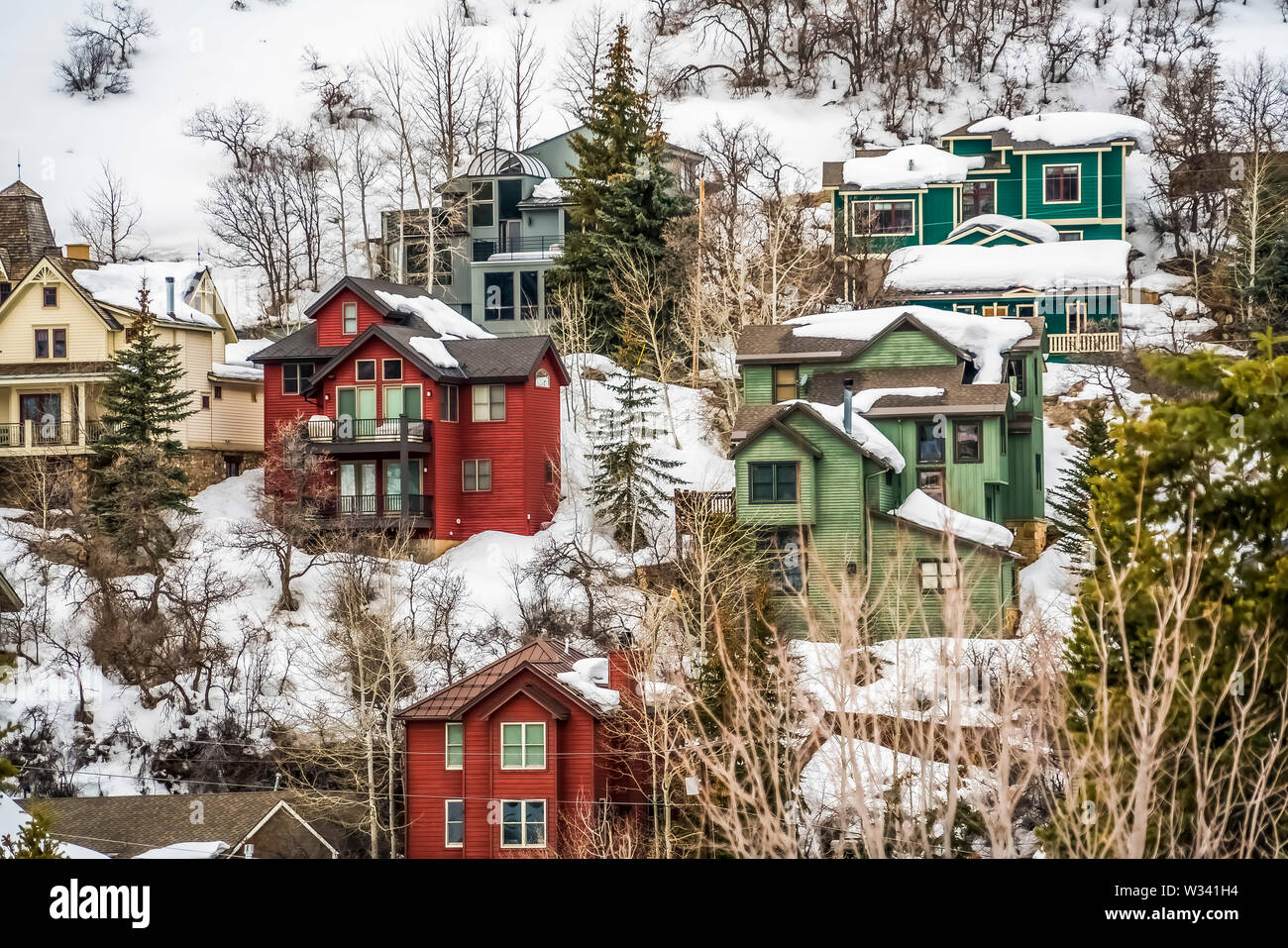 Scenic winter landscape with colorful houses built on the snowy ...