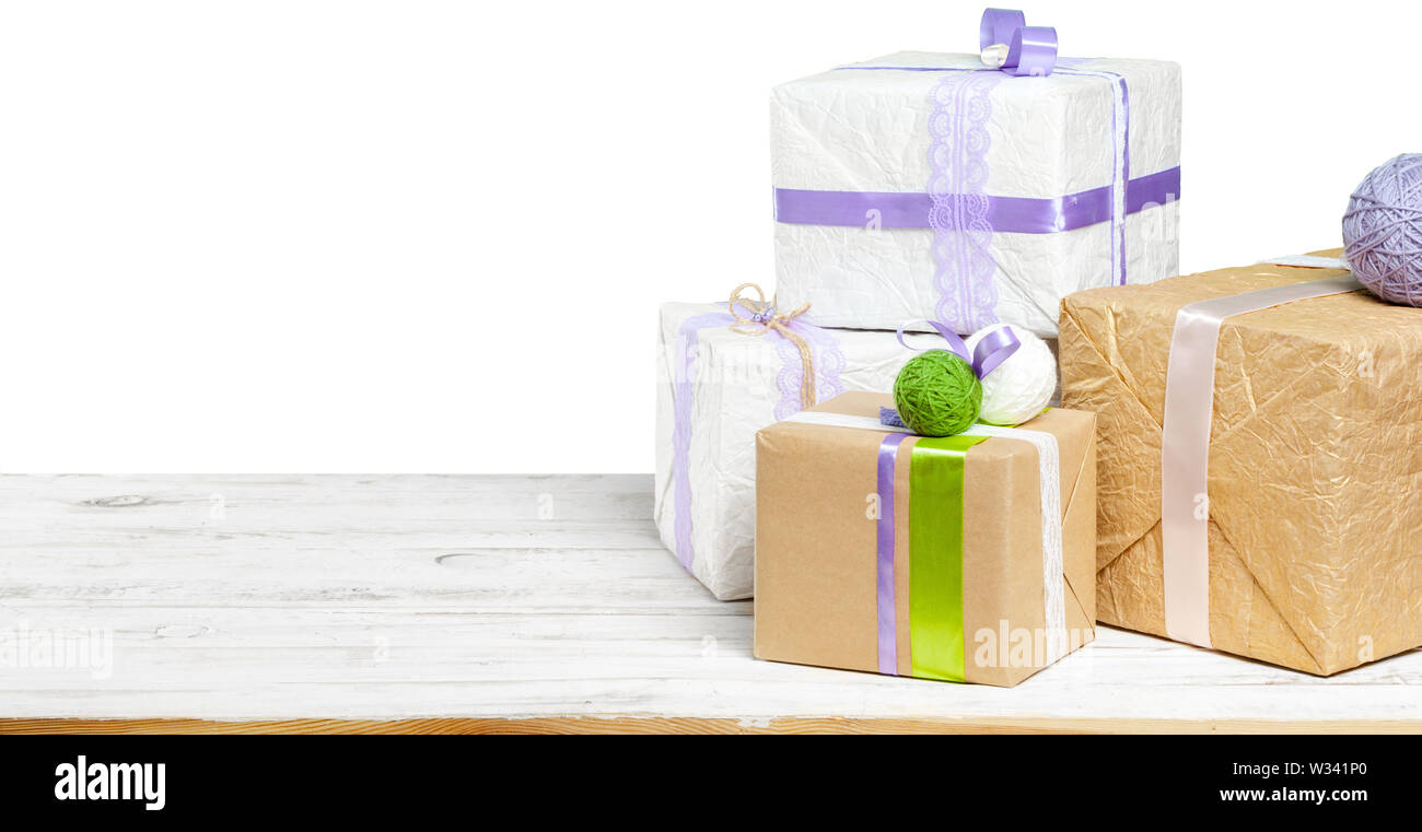 pile of gifts on the old table Stock Photo - Alamy