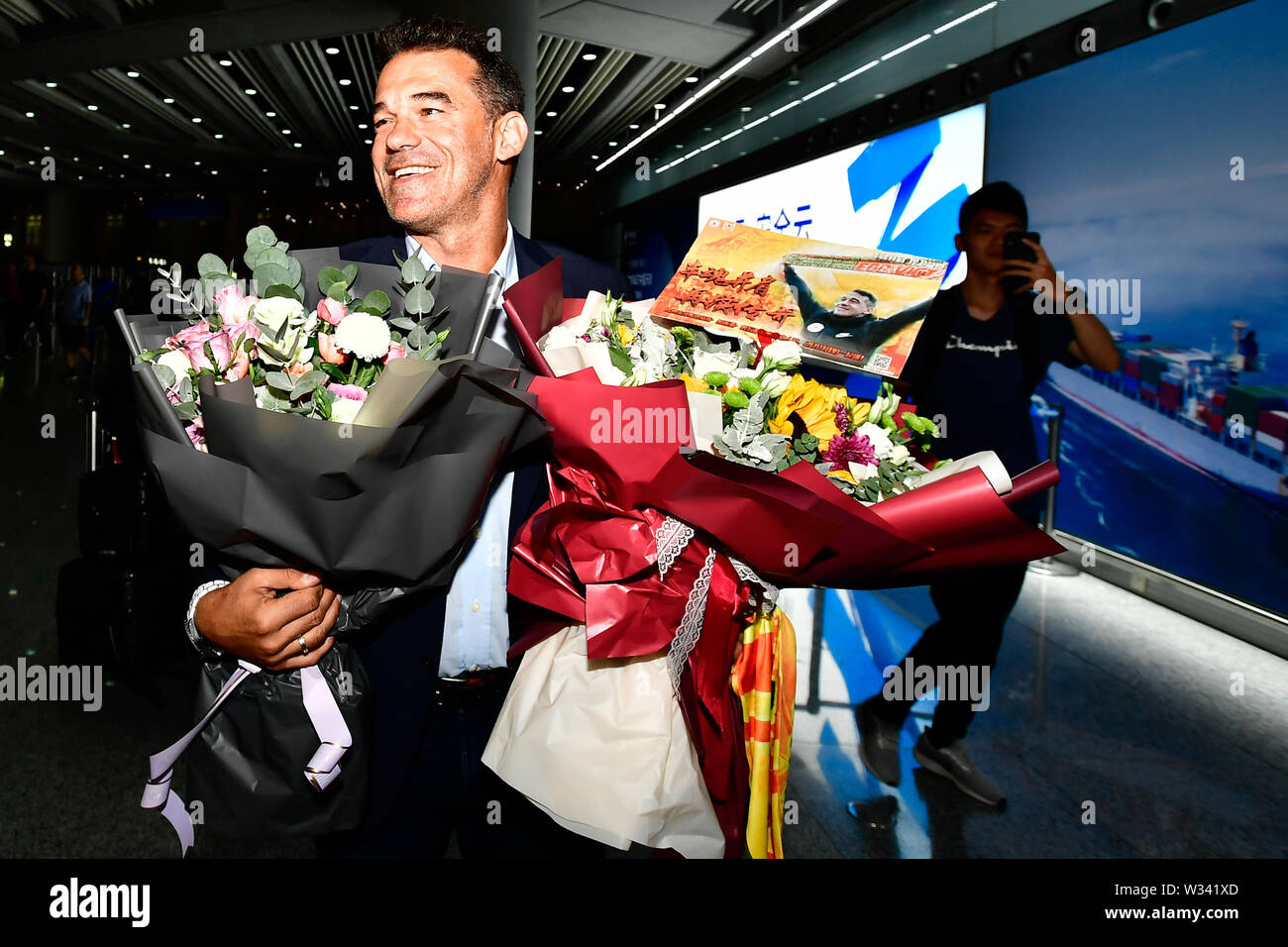 Spanish football manager Luis Garcia of Beijing Renhe F.C. arrives at ...