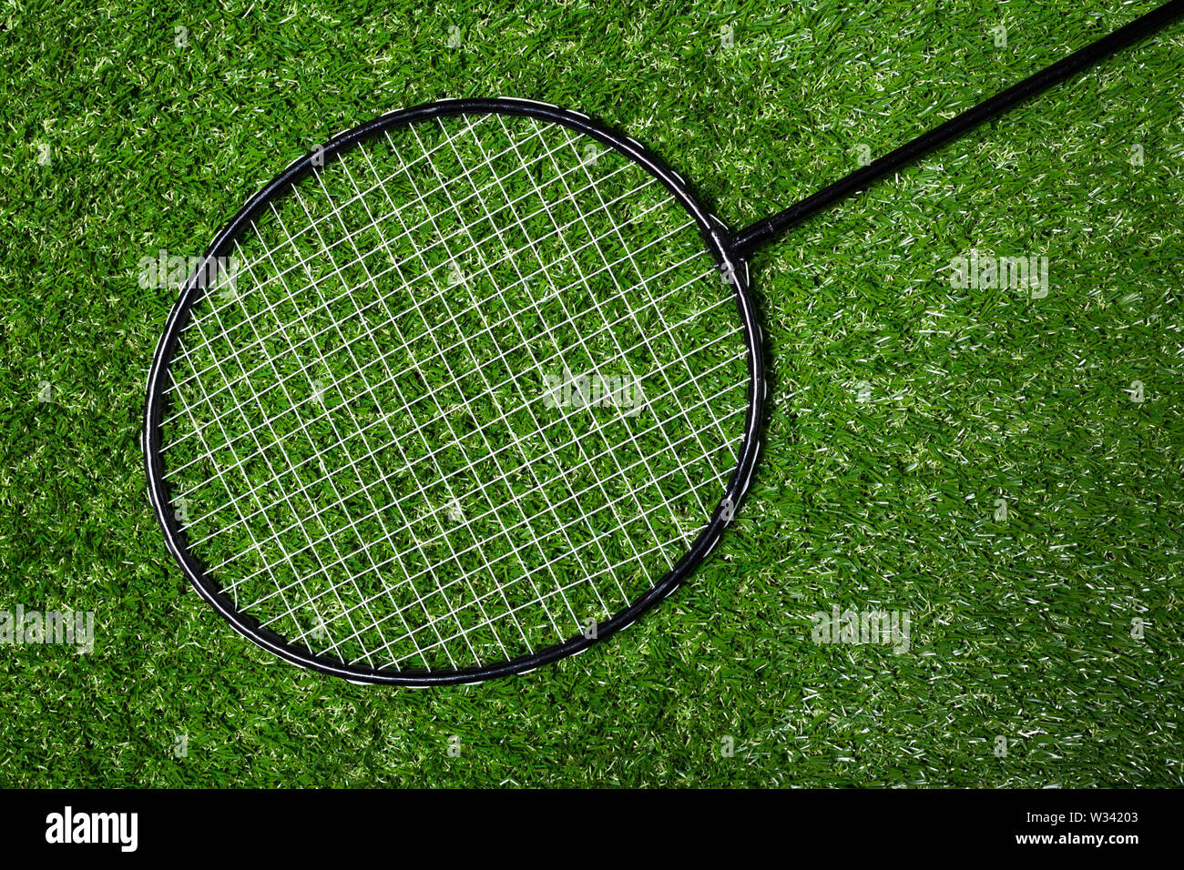 badminton racket on grass Stock Photo - Alamy