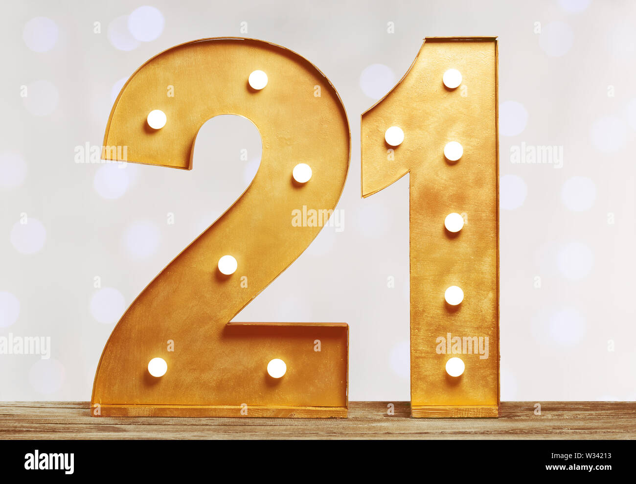 Big plastic numbers with shining light bulbs Stock Photo - Alamy