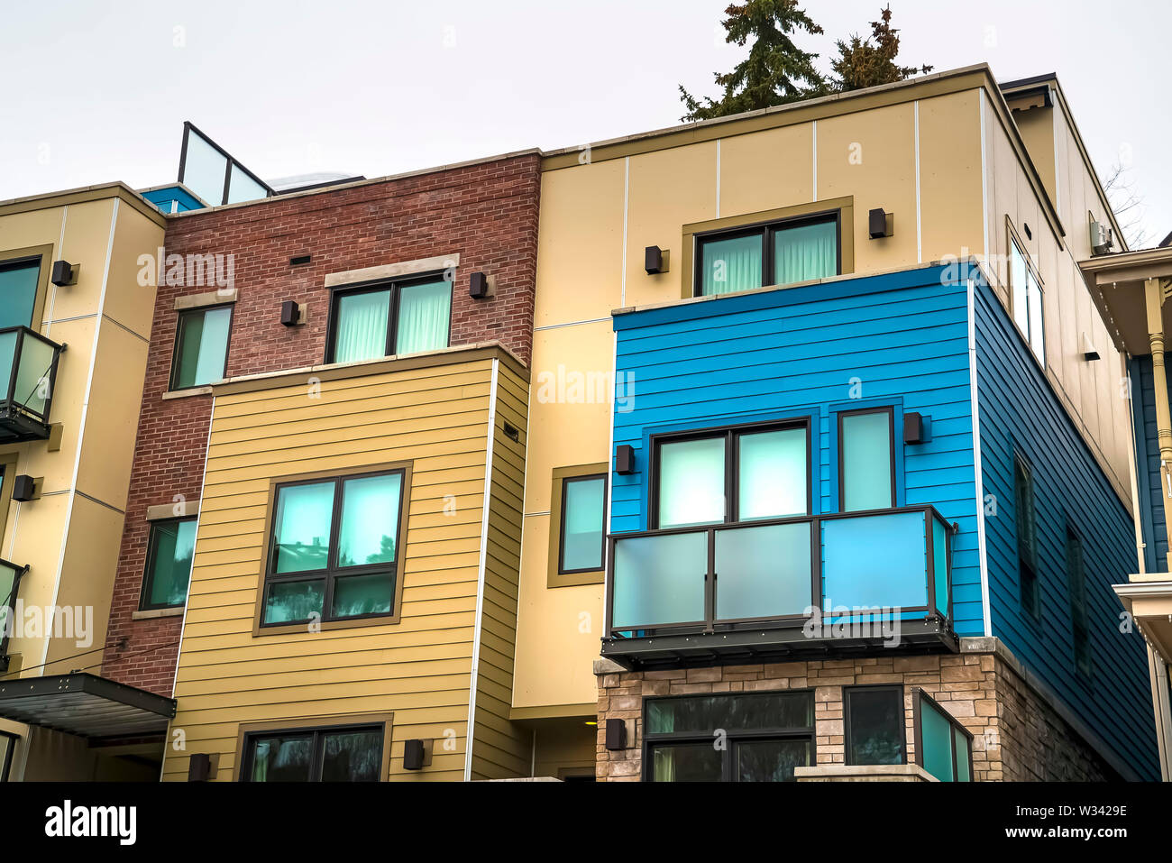 Residential building with horizontal siding concrete and brick on the ...