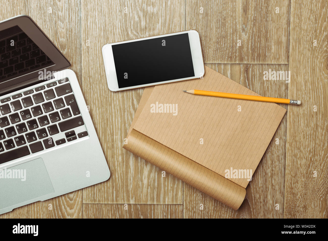 Office table with smartphone on it. View from above Stock Photo - Alamy