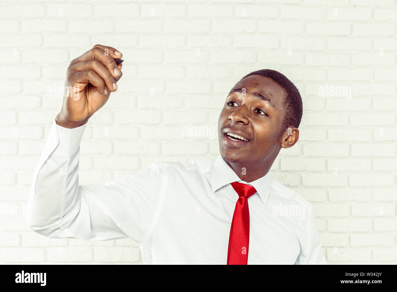 Attractive african american man writing hi-res stock photography and ...