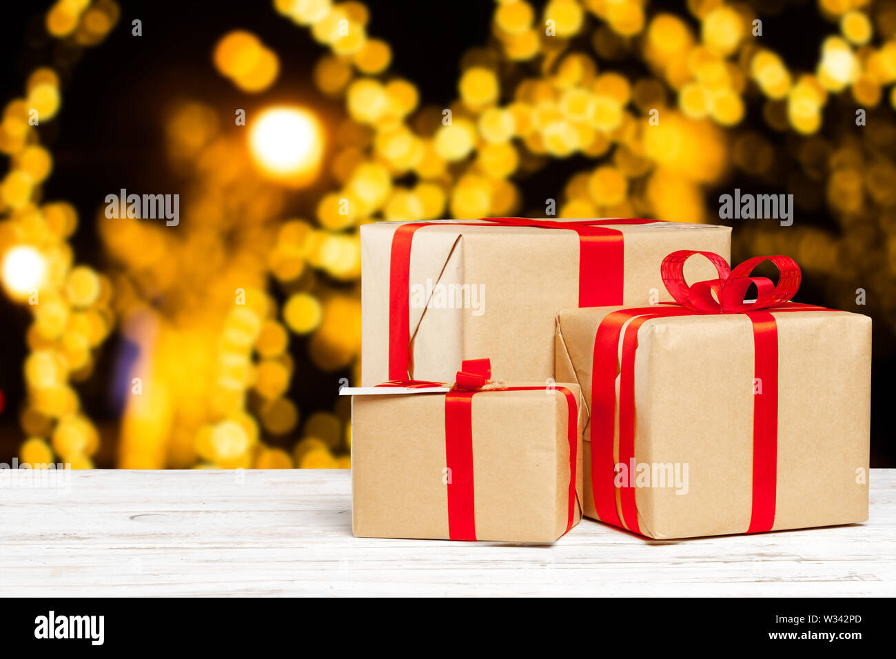 pile of gifts on the old table Stock Photo - Alamy
