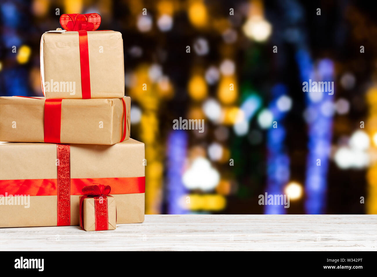 pile of gifts on the old table Stock Photo - Alamy