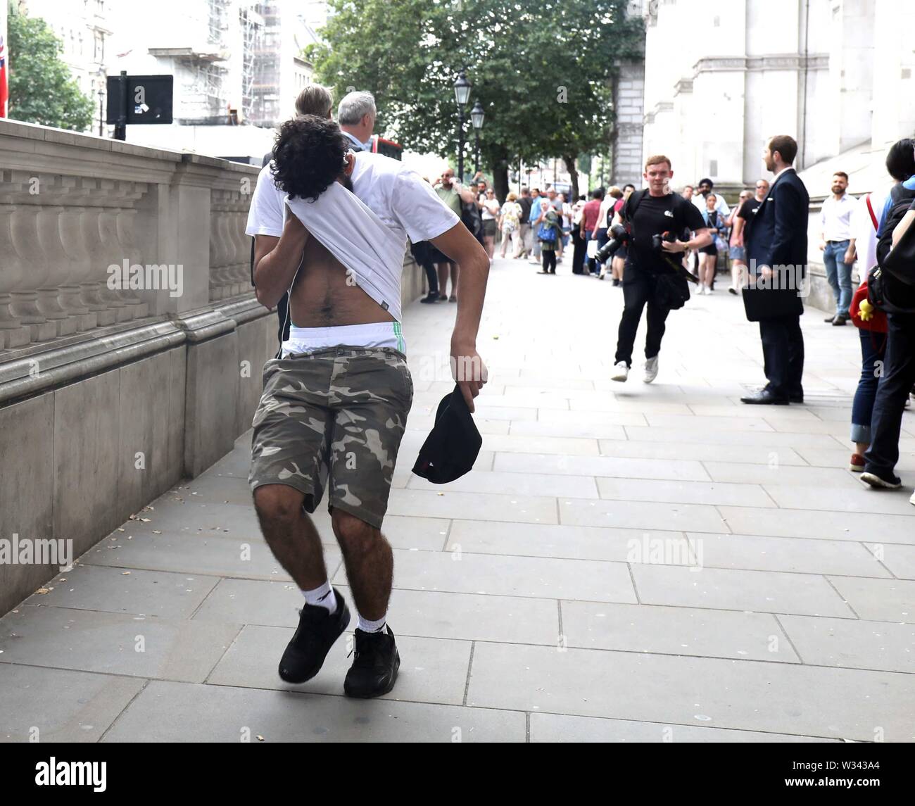 Pic shows: High drama at Westminster Islamic looking man flees the mob ...