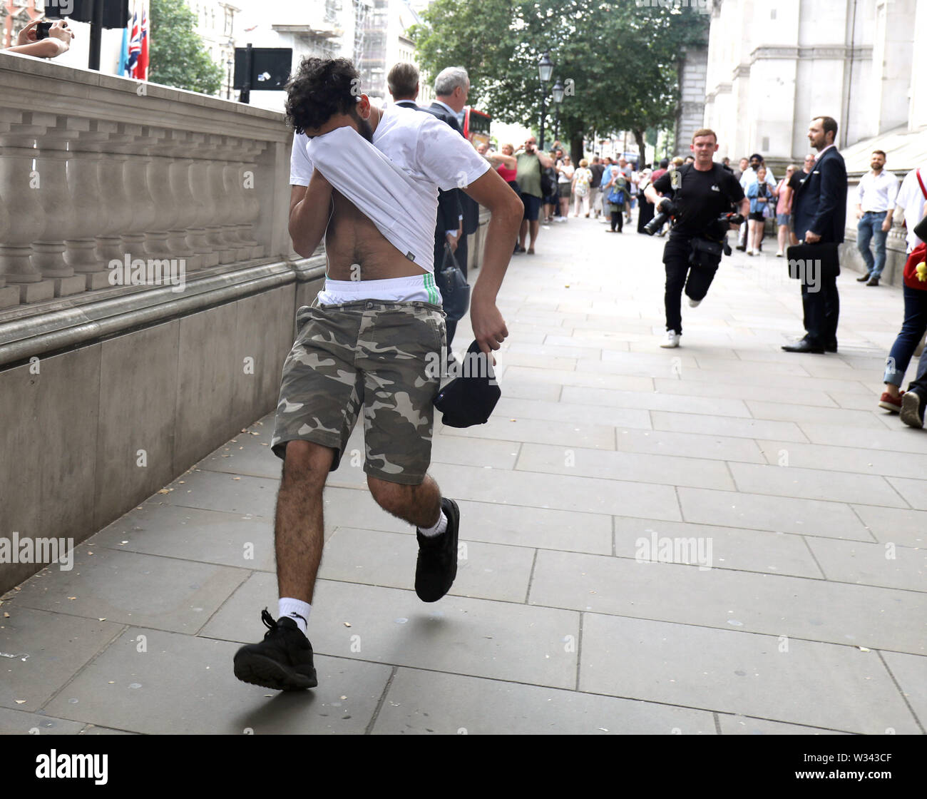 Pic shows: High drama at Westminster Islamic looking man flees the mob ...