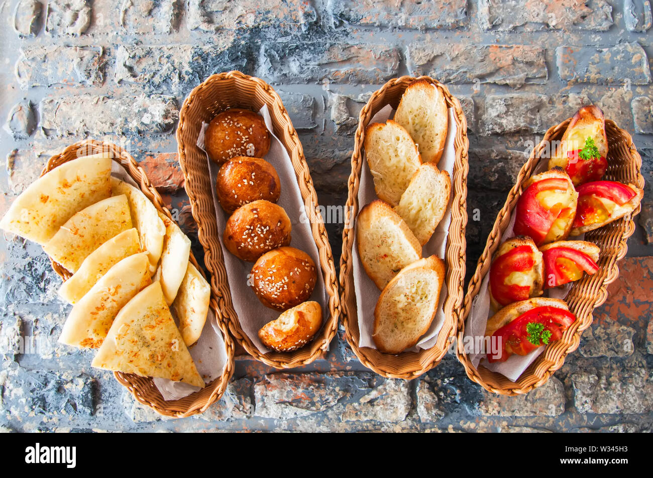 Variety bread snacks in a basket. Top view Stock Photo - Alamy