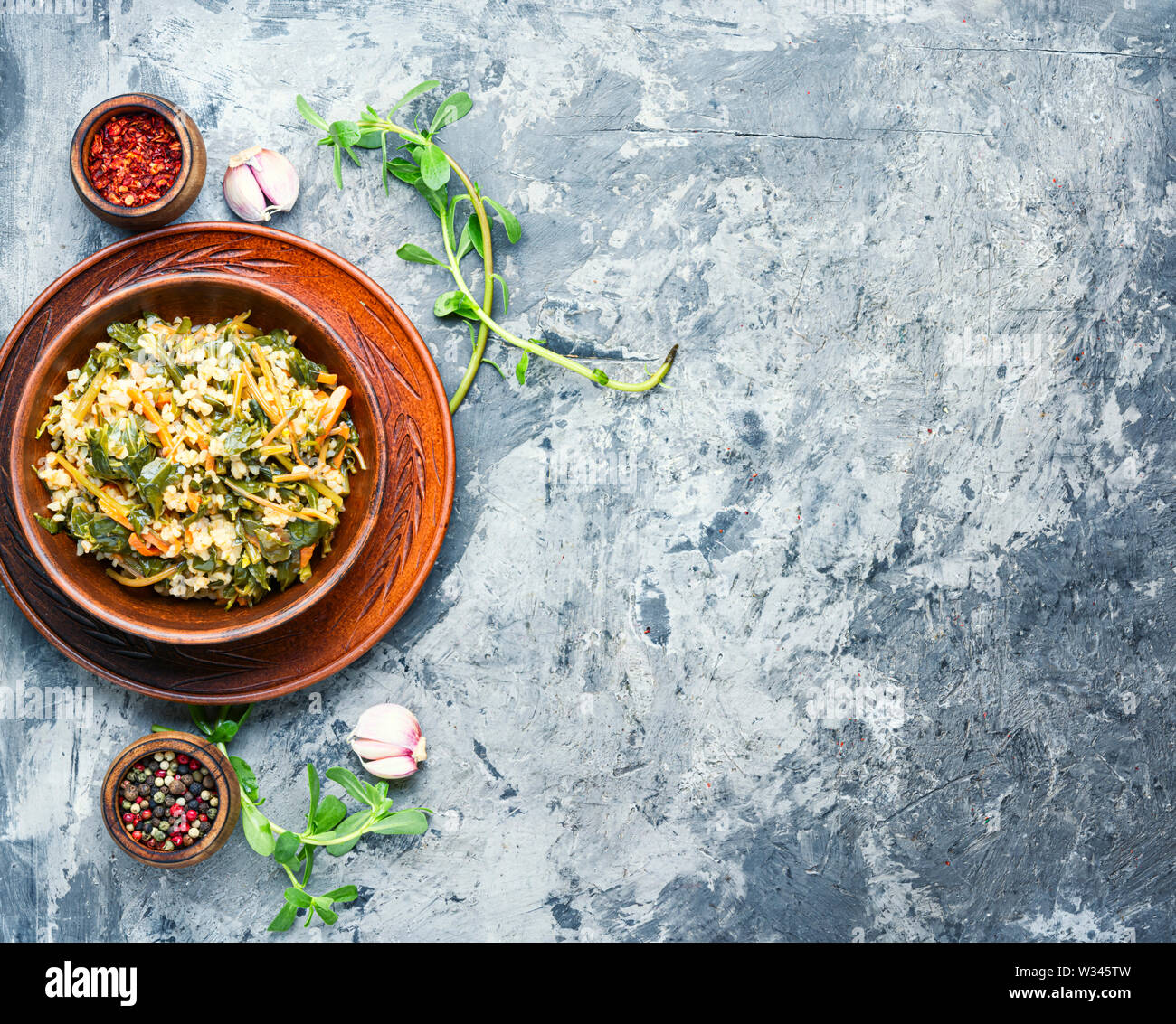 Popular food of the Middle East.Stew bulgur.Bulgur with portulak Stock ...