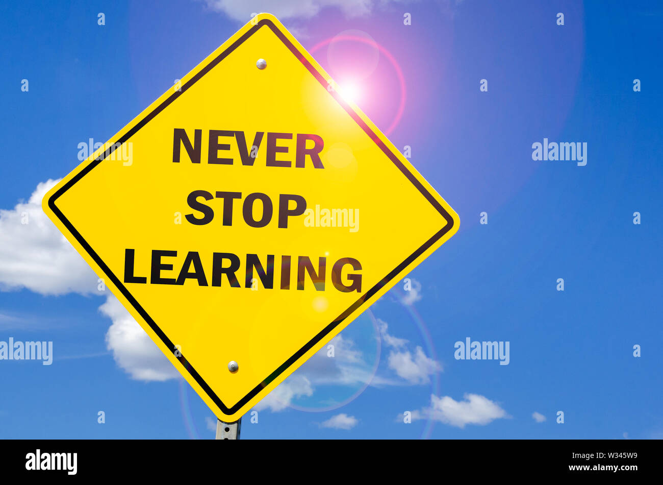 Conceptual warning road sign about learning against Blue Sky Stock ...