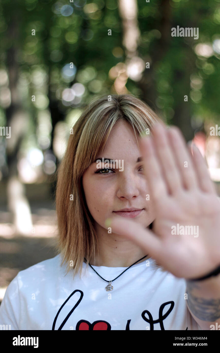 a girl showing left hand in front of the camera. stop signal Stock ...
