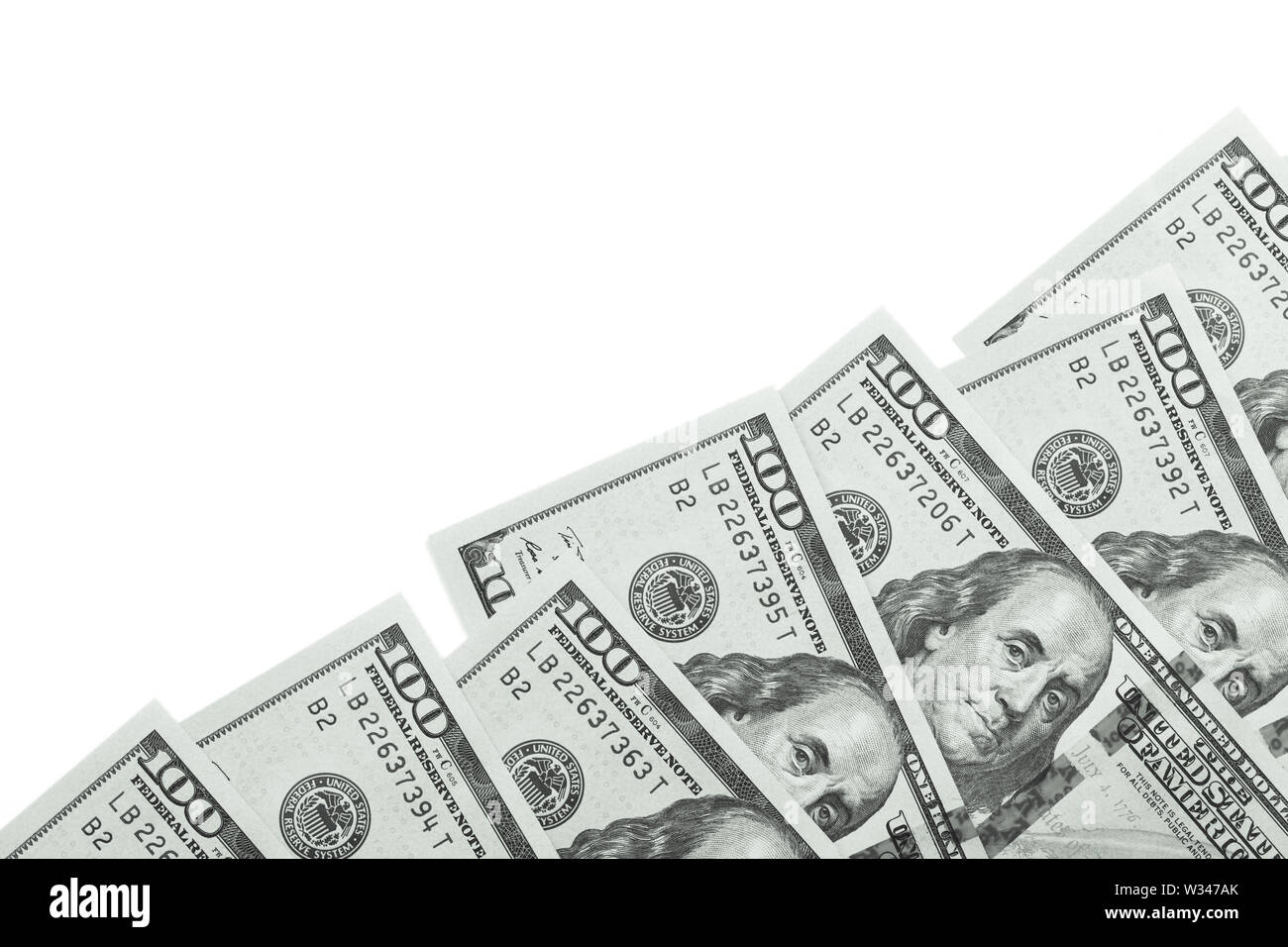 Dollars laid out in a row on white background Stock Photo - Alamy