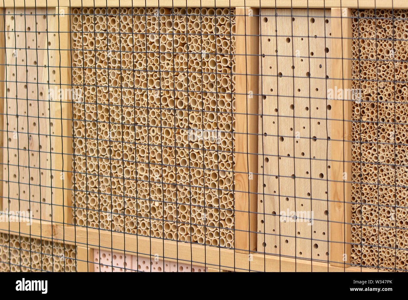 Close up of a wooden insect house hotel structure created to provide ...