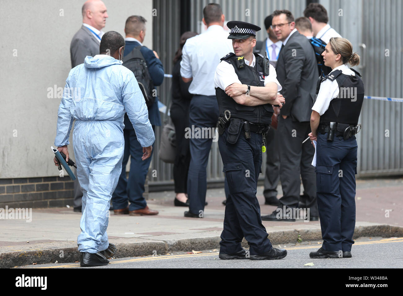 Police at the scene of a stabbing on Ordnance Road, Newham, east London ...