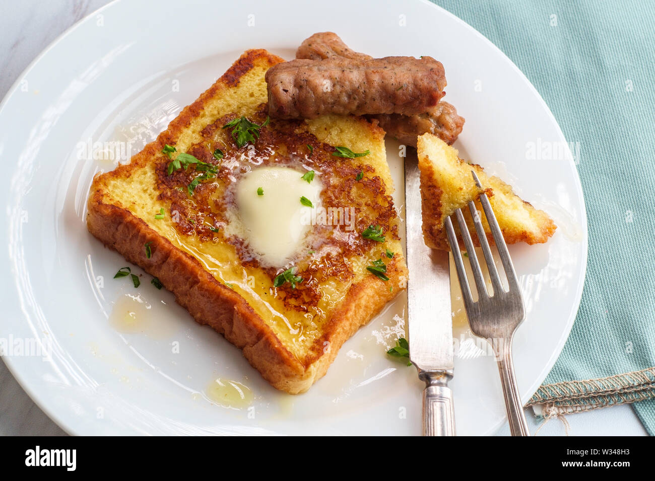Classic American breakfast french toast with maple syrup served with ...