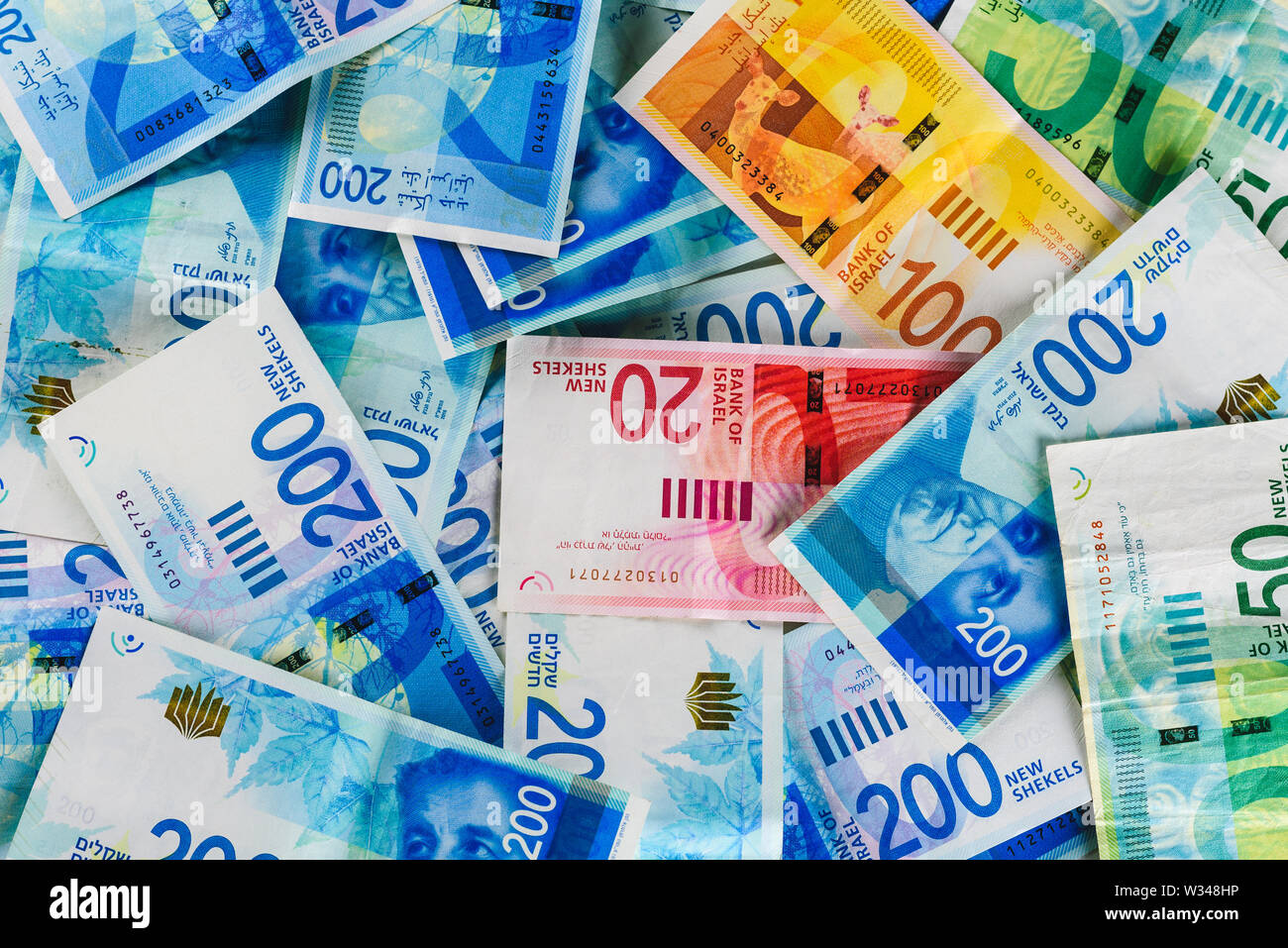 Stack of various Israeli shekel bills. Israel money banknotes of 50, 20 ...