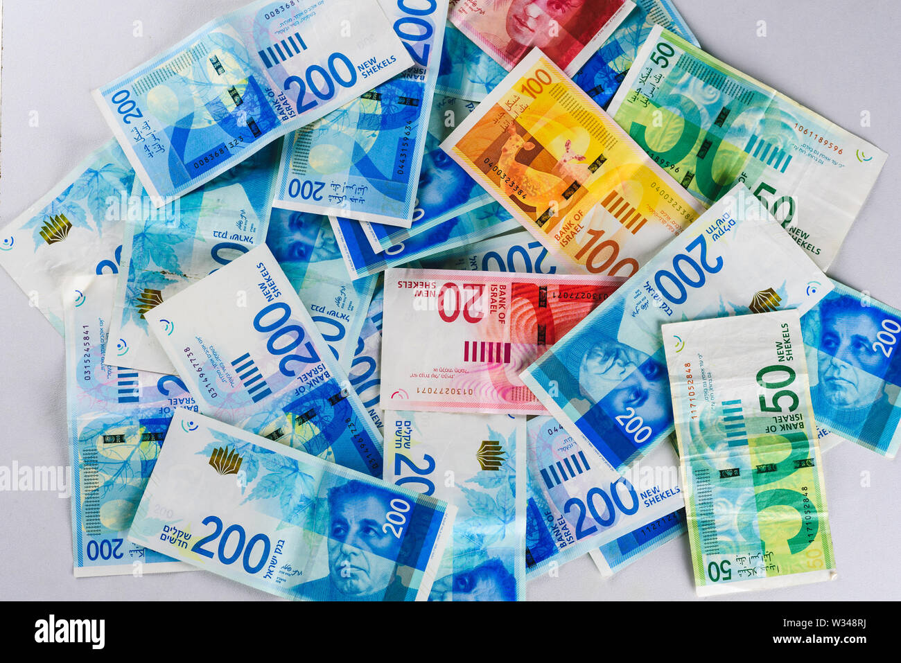 Stack of various Israeli shekel bills. Israel money banknotes of 50, 20 ...