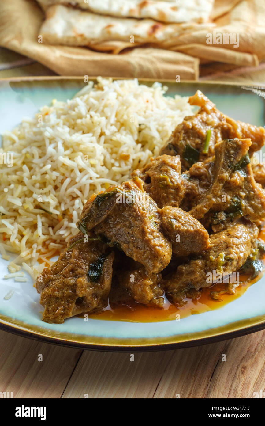 Authentic Indian goat korma curry with jasmine rice Stock Photo - Alamy
