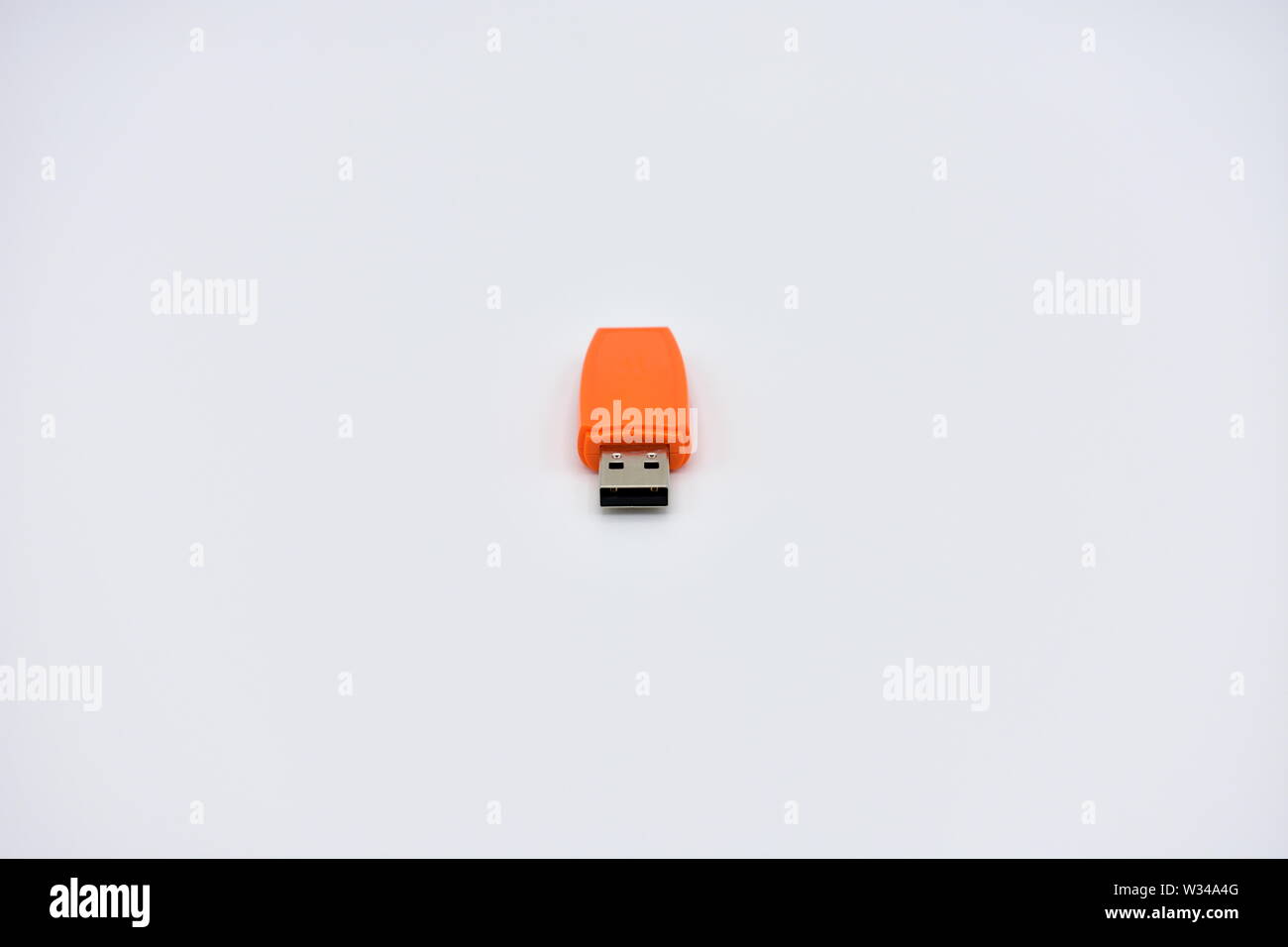 Orange USB flash memory drive on a white background Stock Photo - Alamy