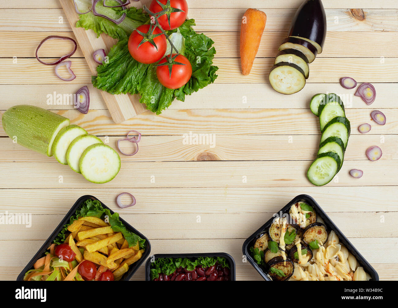 rustic table with breakfast, lunch and dinner. Raw vegetables Stock ...