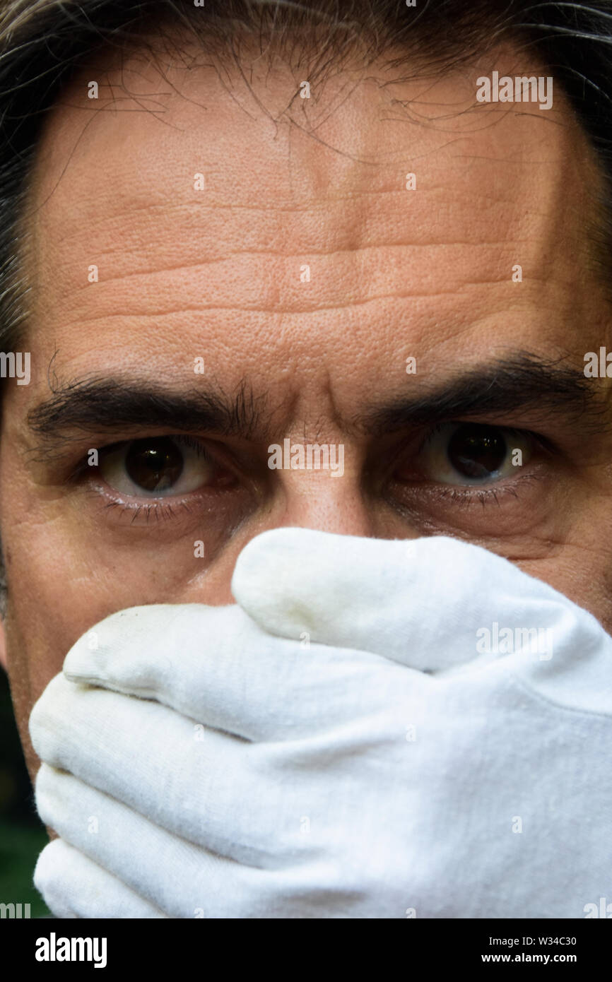 Partially covered face hi-res stock photography and images - Alamy