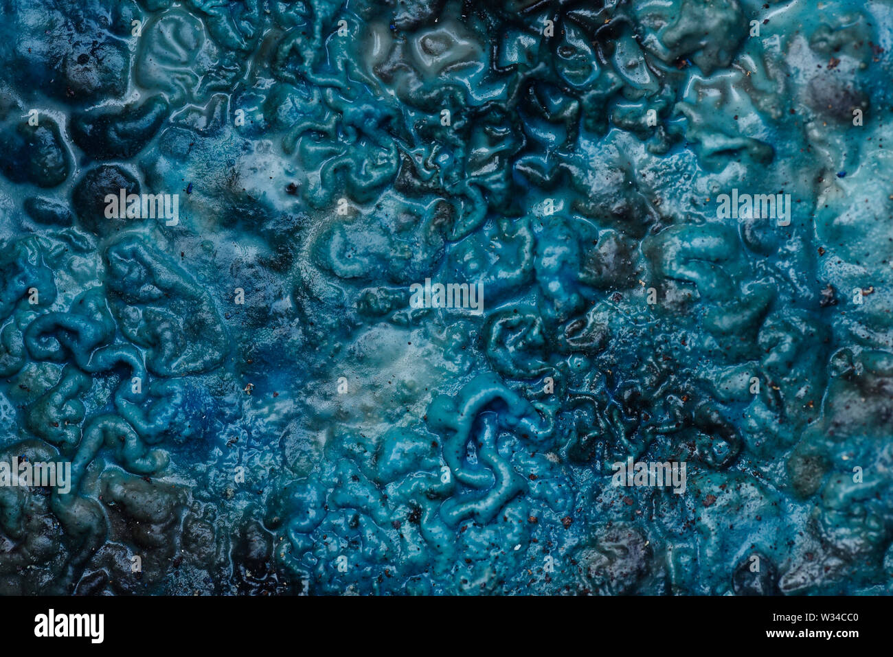 The wrinkled and contorted surface of skinned over old paint, could be ...