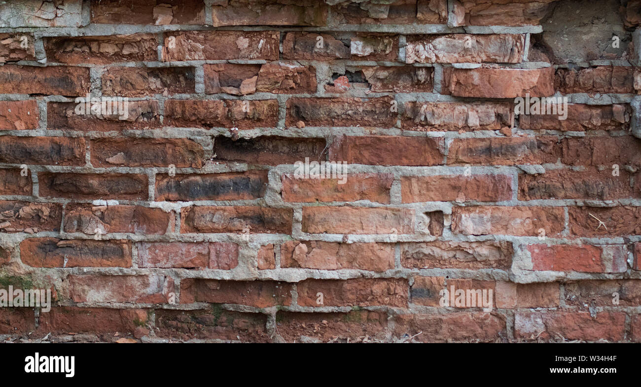 Old weathered rough textured brickwork. broken brickwork with gray ...