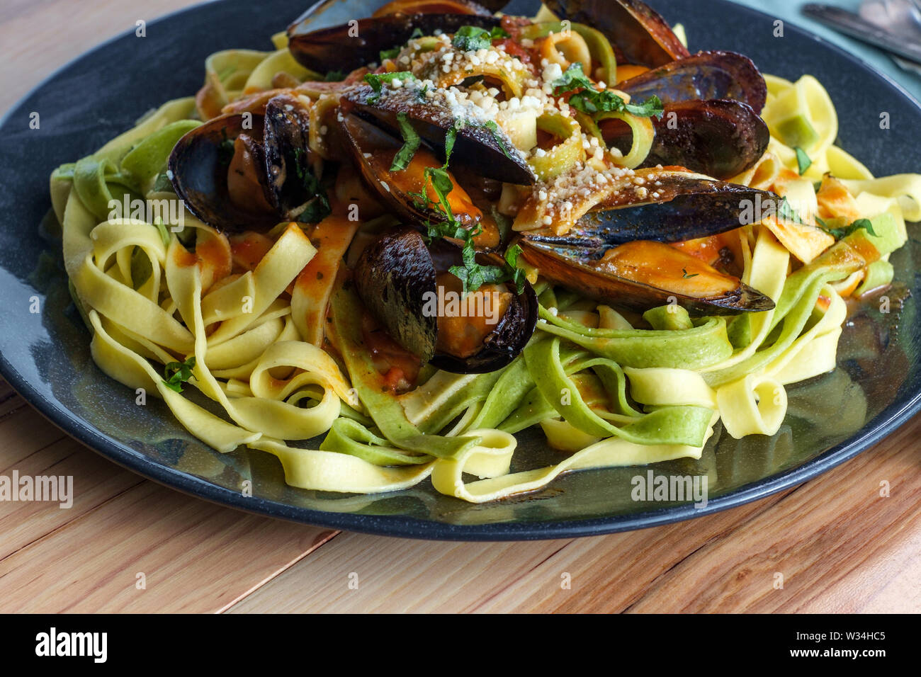 Seafood shell-on mussels marinara Italian seafood dish with tagliatelle ...