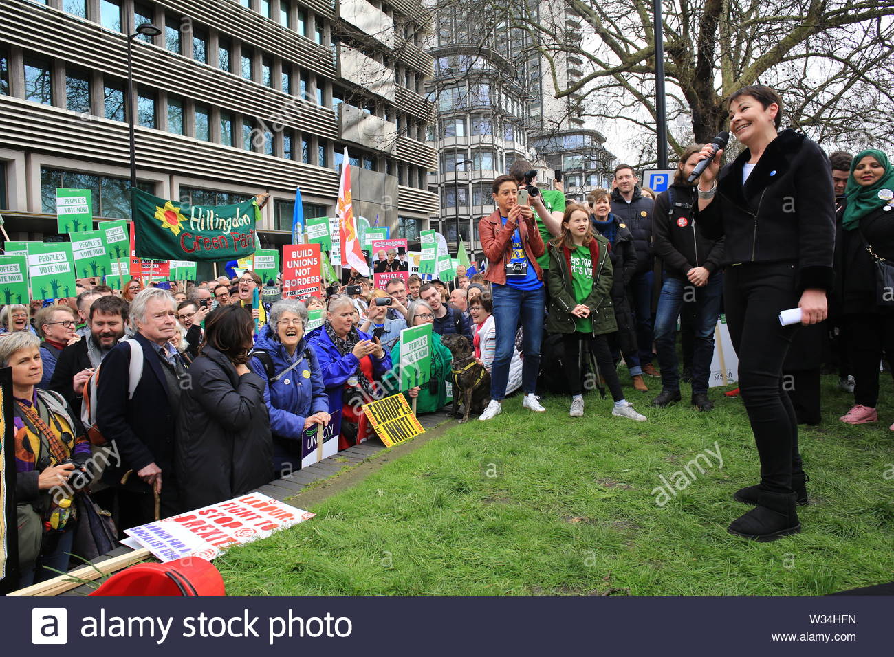 Rally crowd listening to speech hi-res stock photography and images - Alamy
