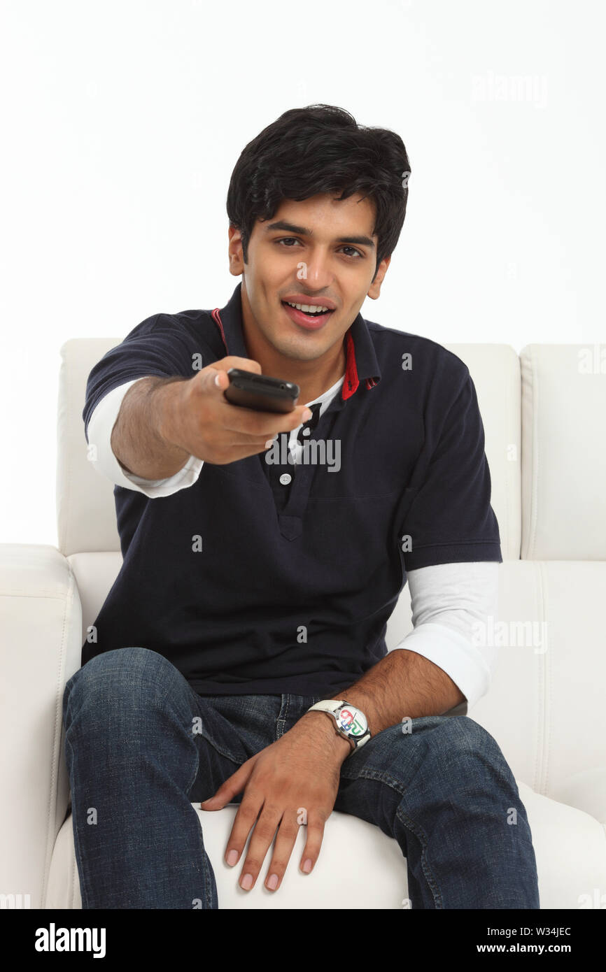 Indian man watching television Stock Photo - Alamy