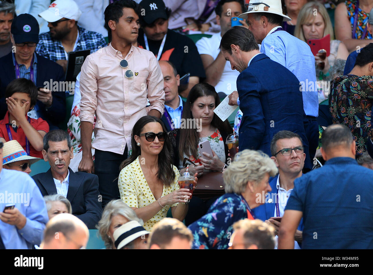 Pippa Matthews and husband James Matthews with a glass of Pimm's on day ...