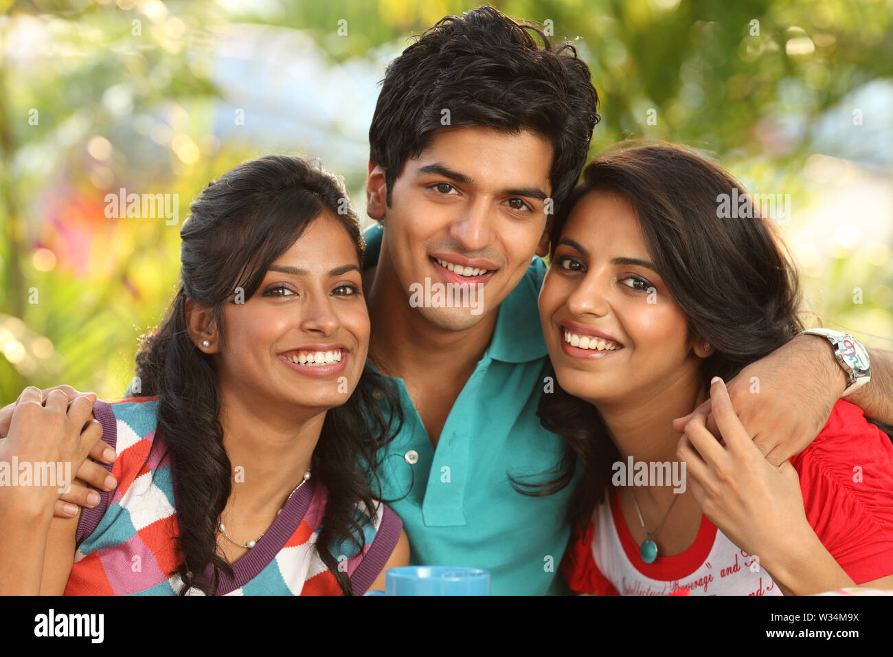 Portrait of three friends smiling Stock Photo - Alamy