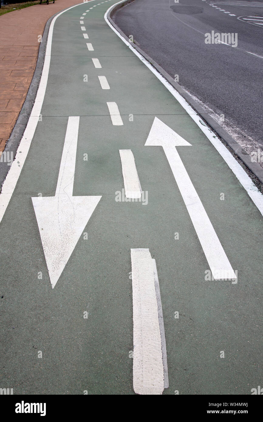 Arrow Symbols on Cycle Path Stock Photo - Alamy