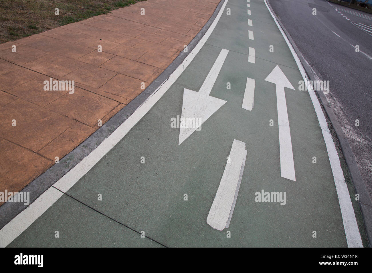 Arrow Symbols on Cycle Path Stock Photo - Alamy