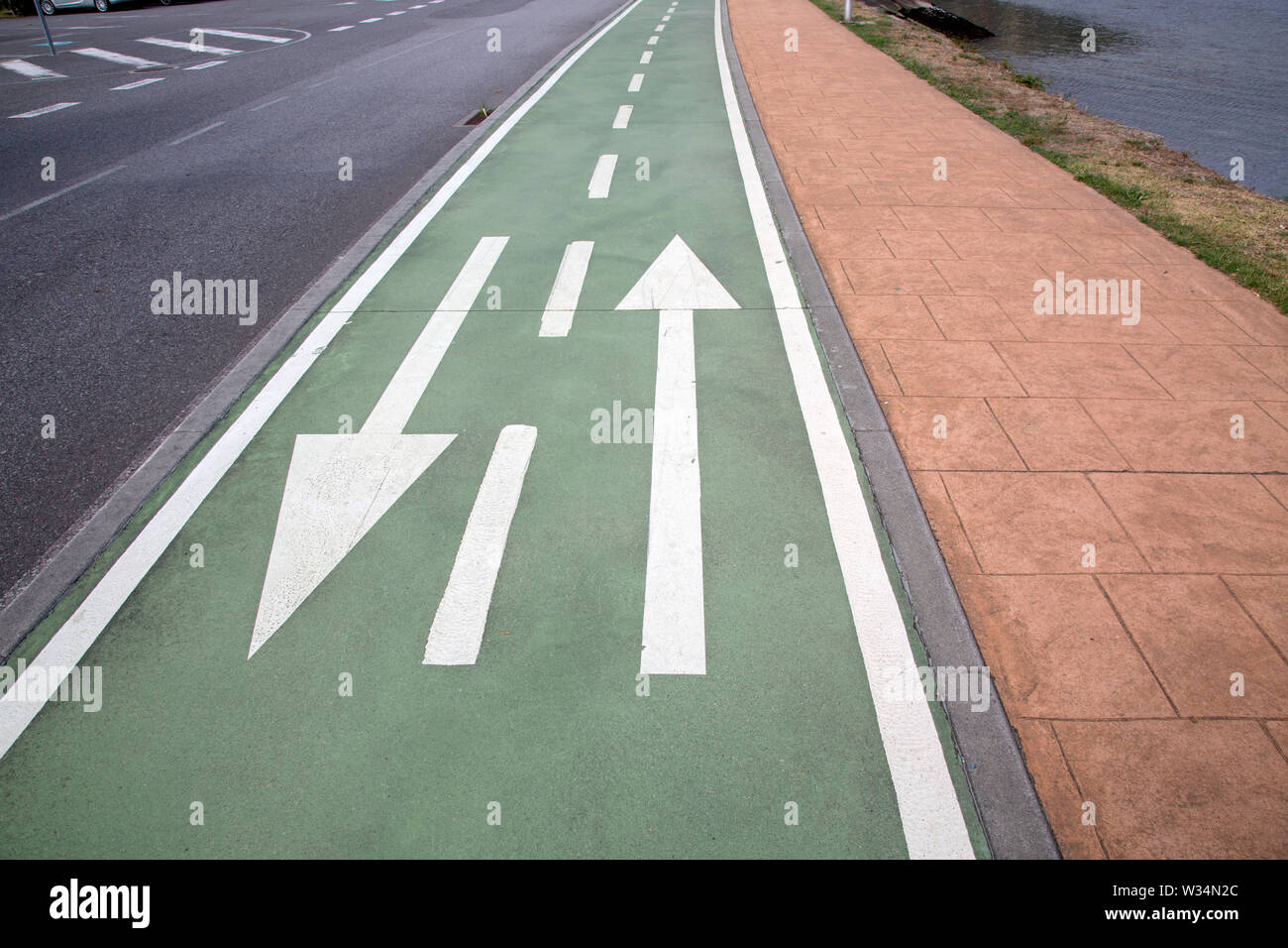 Arrow Symbols on Cycle Path Stock Photo - Alamy