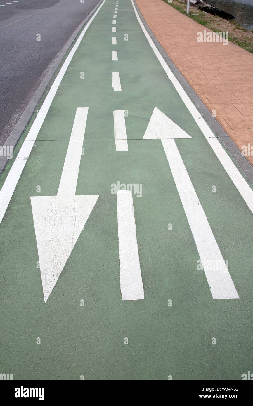 Arrow Symbols on Cycle Path Stock Photo - Alamy