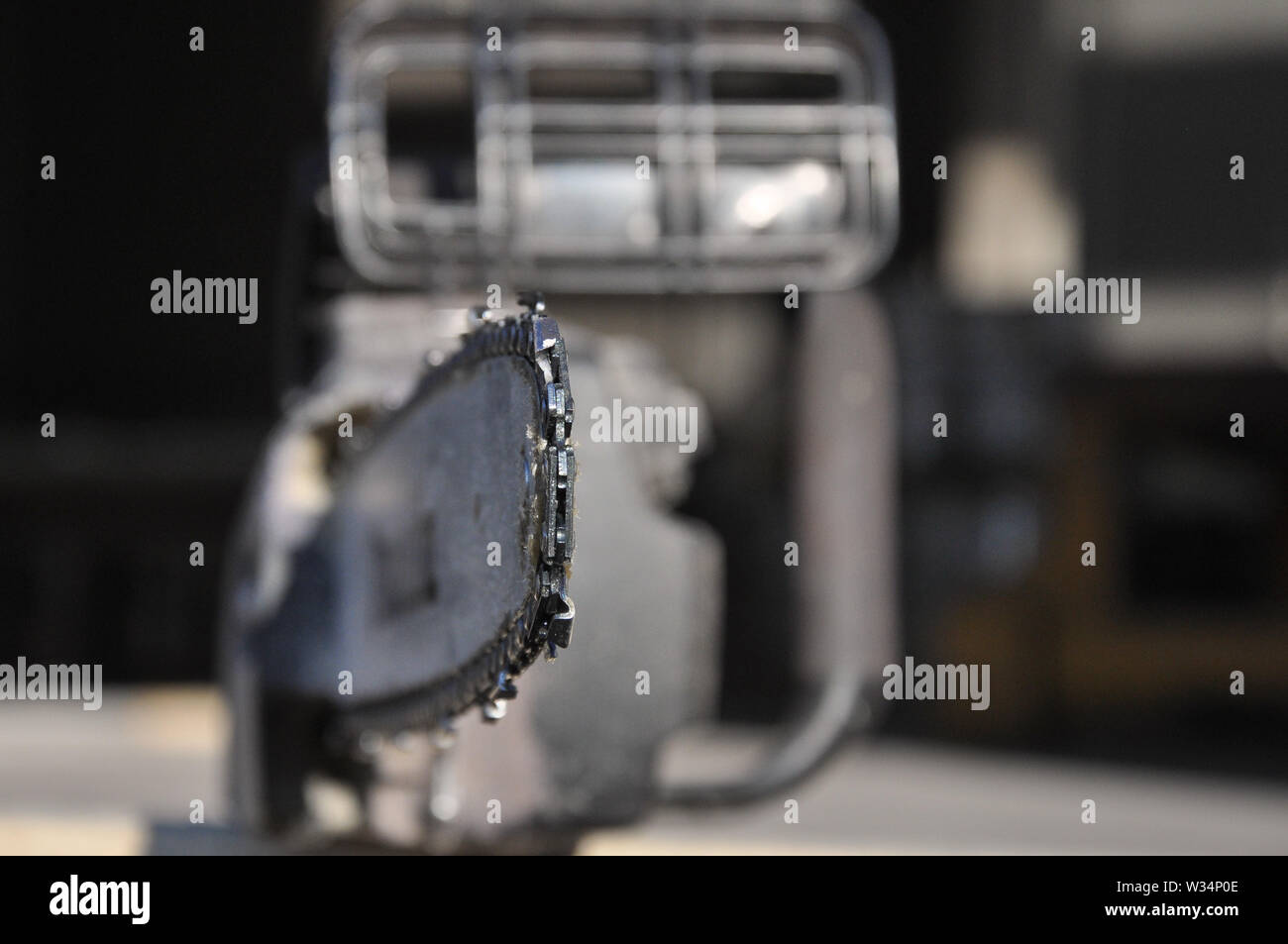 Chainsaw. Close-up of saw chain with residues of sawdust and wood dust ...