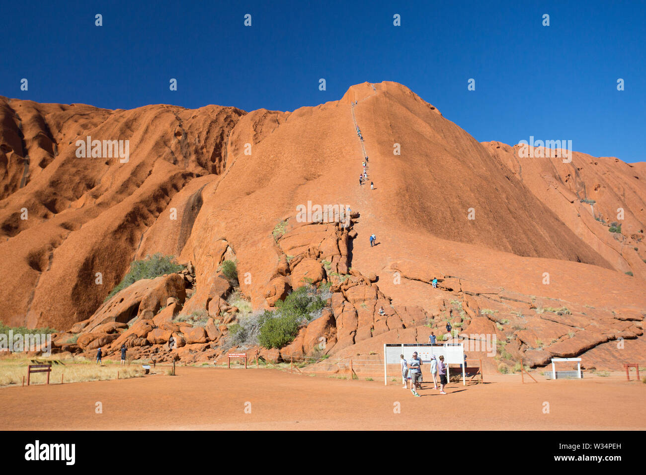 Uluru Rock Climbers Stock Photo - Alamy