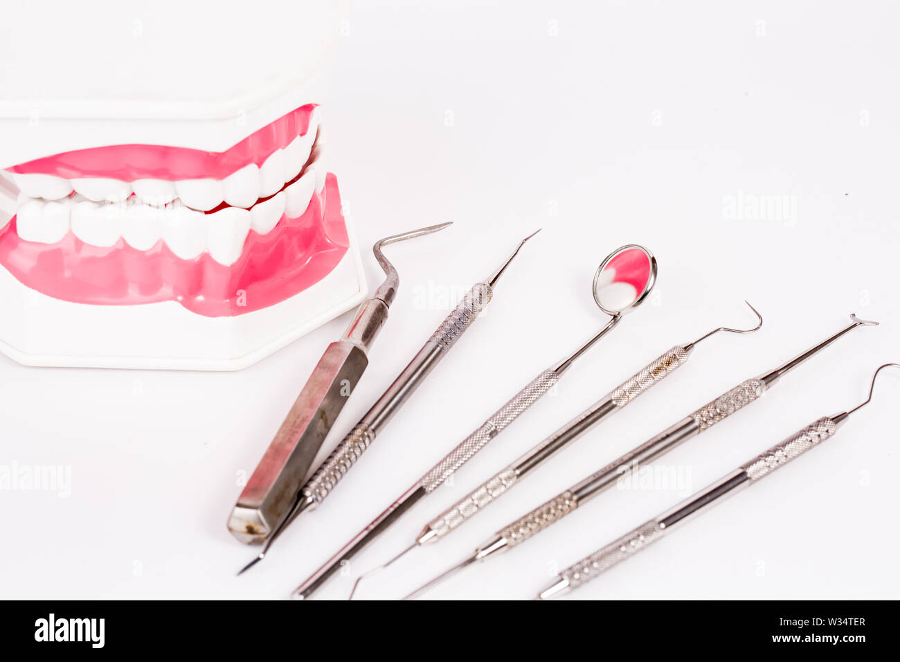 dentist tools isolated on white background Stock Photo - Alamy