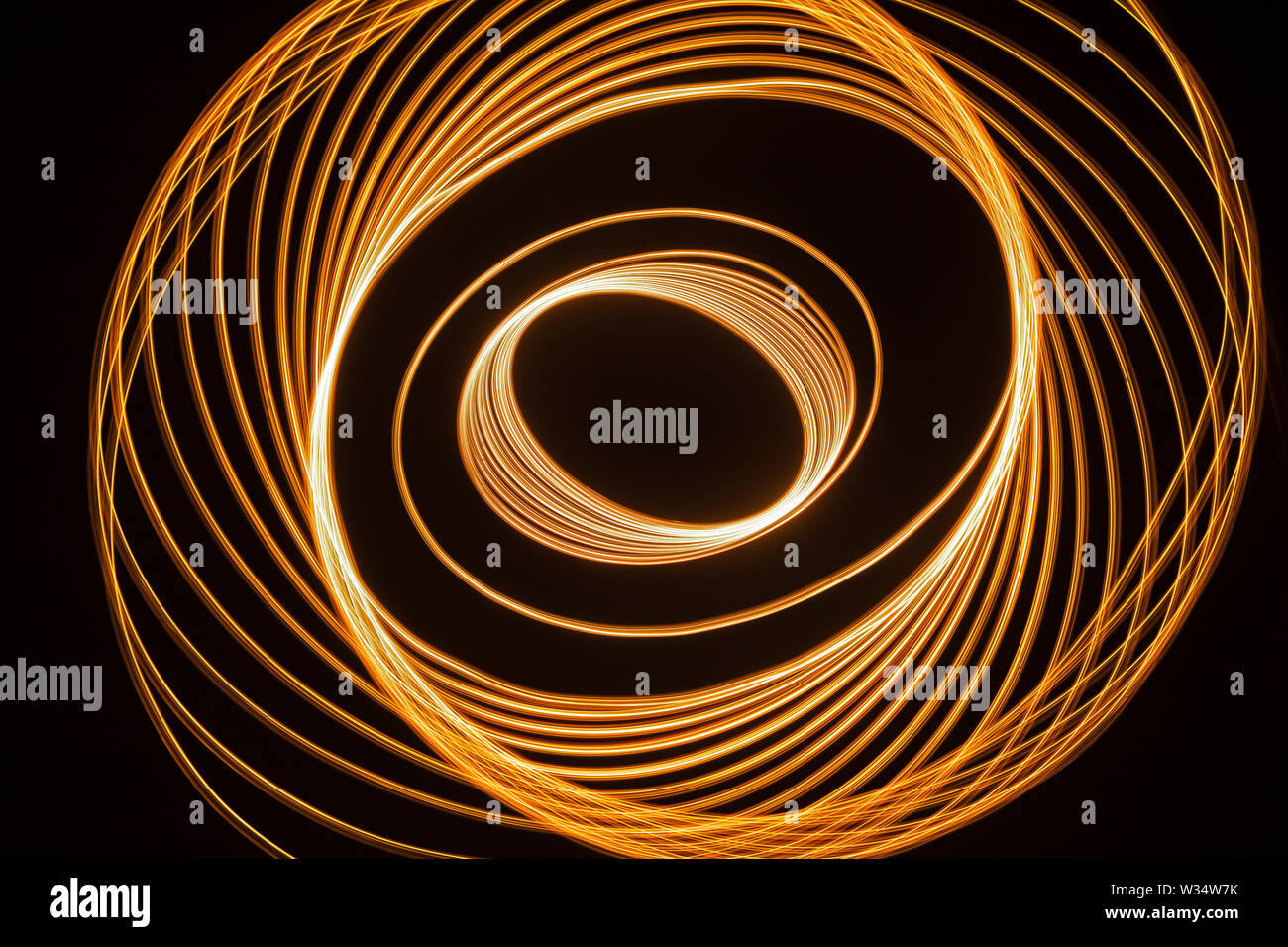 Light trails and patterns against black background Stock Photo - Alamy